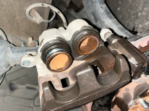 Brake Caliper Leaking Fluid from Piston: Causes, Symptoms, and ...